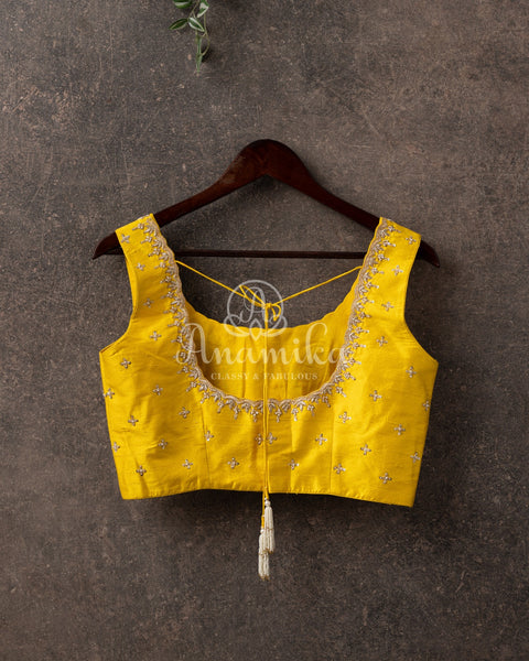 Yellow Sleeveless blouse with simple yet elegant gold work – Anamika ...